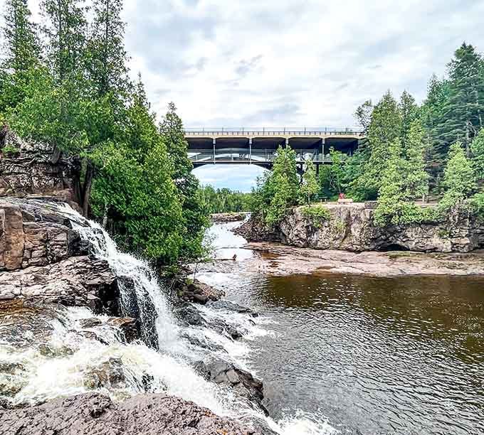 Highway 61 bridge photobombing the falls proves even infrastructure knows how to frame a perfect Minnesota moment.