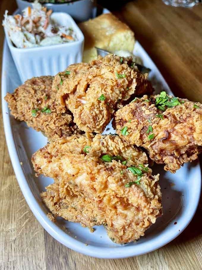Golden, crispy perfection that'll have you reconsidering every piece of fried chicken you've ever eaten before this moment.