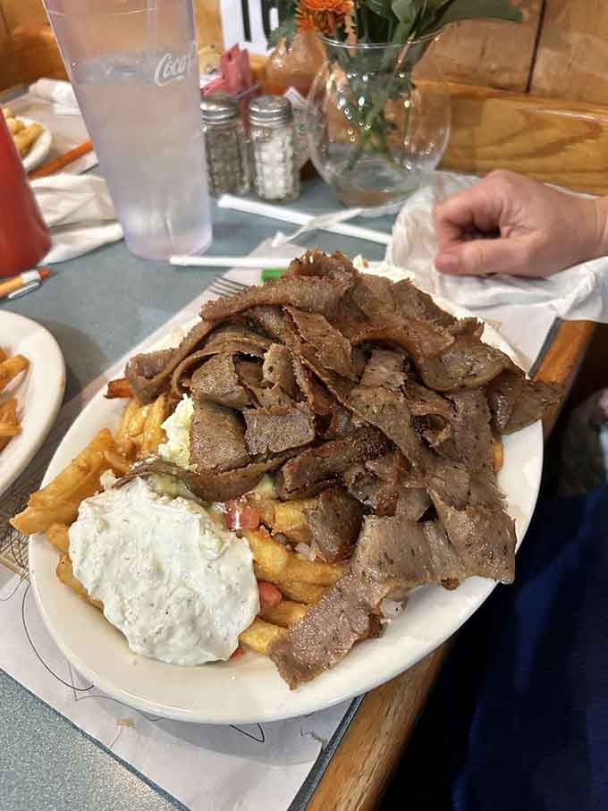 This mountain of gyro meat isn't just dinner &ndash; it's an expedition worth embarking on, complete with tzatziki base camp.