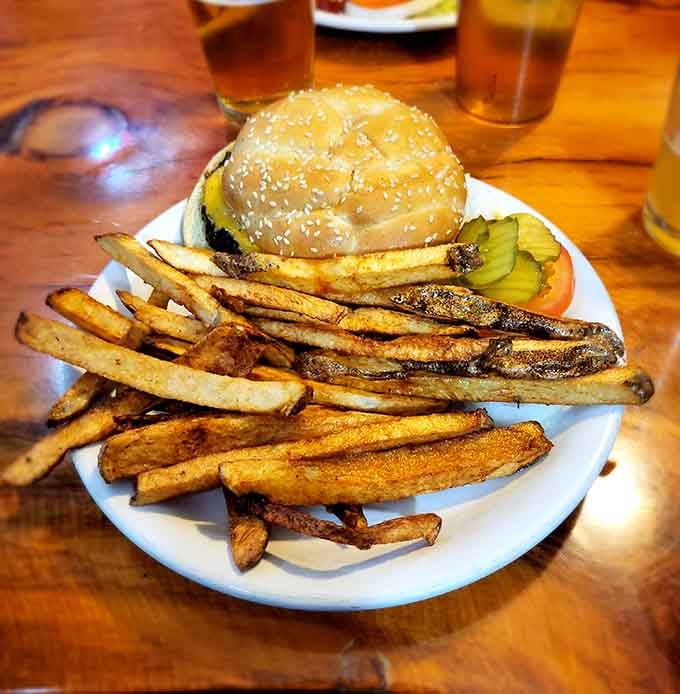 Behold the star of the show: a half-pound of beefy perfection paired with hand-cut fries. Architecture that makes Frank Lloyd Wright jealous.