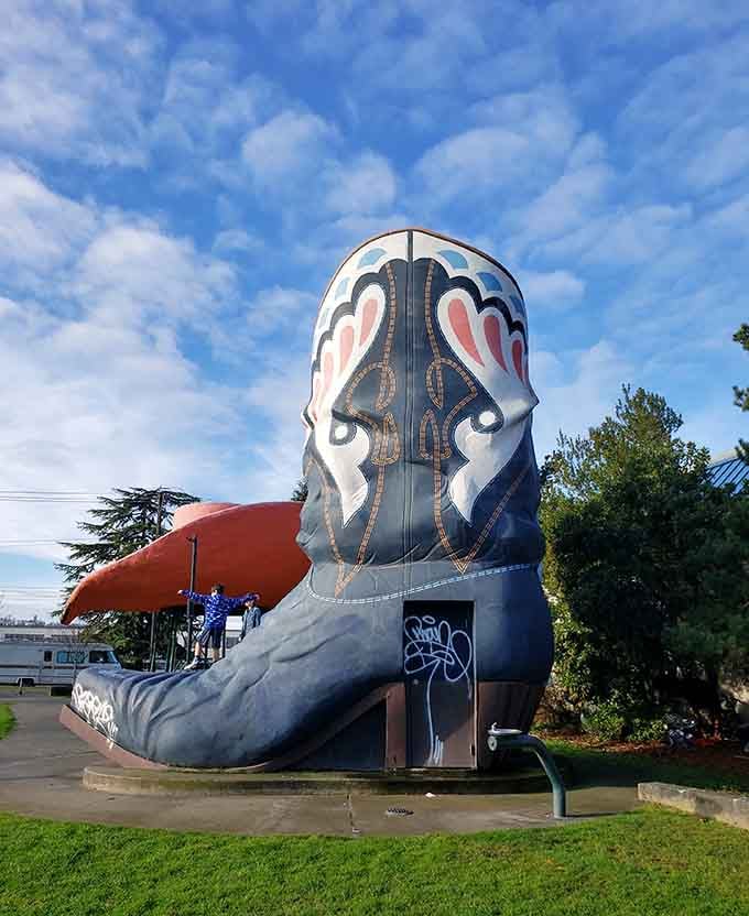 Nothing says "photo opportunity" quite like perching on footwear designed for a friendly giant cowboy.