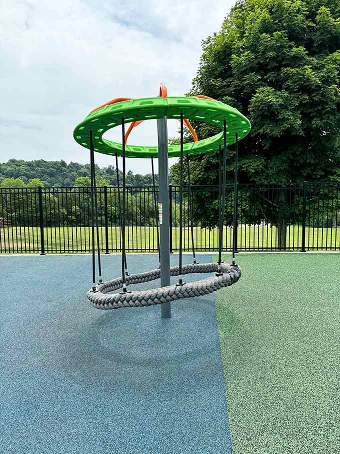 Quietly waiting under open skies, this rope swing stands like a hidden gem, a simple joy that turns ordinary park days into unforgettable childhood memories.