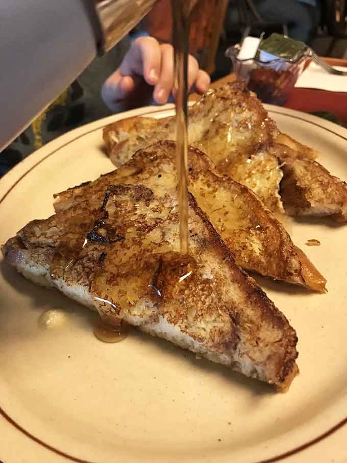 French toast done right: golden, perfectly cooked, and drizzled with enough syrup to make your morning magical.