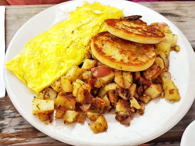 Golden home fries that crackle with each bite, alongside a perfect omelet and English muffins toasted to that magical point between soft and crunchy.