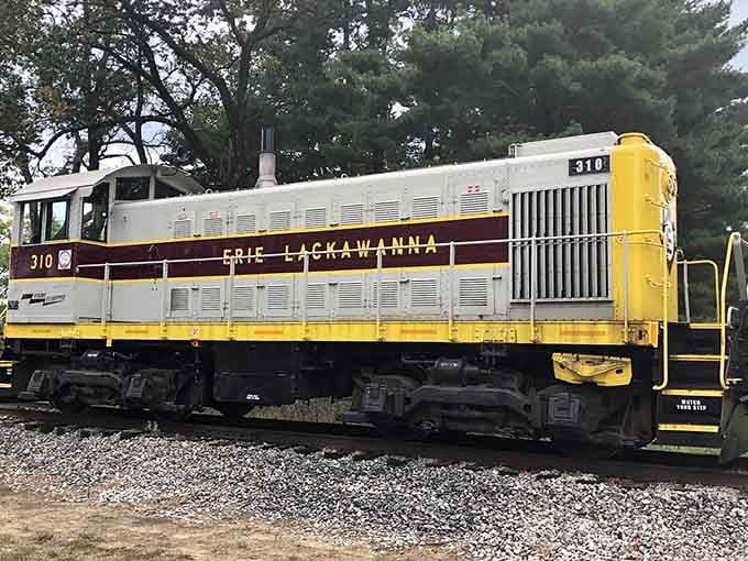 This yellow and maroon Erie Lackawanna diesel locomotive #310 represents the transition era when steam gave way to more modern power.