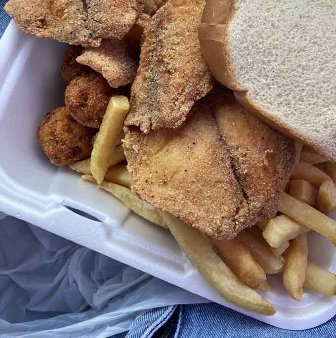 Look at those hush puppies nestled among the fish and fries! Little cornmeal spheres of joy that deserve their own fan club.