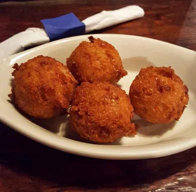 Golden-brown hush puppies that would make your Southern grandmother weep with joy. Crispy exterior, fluffy interior&mdash;these little spheres of cornmeal perfection demand a moment of respectful silence.