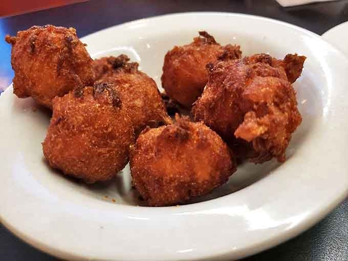 These golden-brown hush puppies aren't just sides&mdash;they're the opening act that steals the show with their crispy-outside, tender-inside perfection.