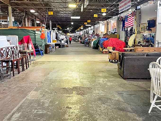 The market's main corridor stretches like an urban canyon of commerce, where each numbered stall promises its own microclimate of merchandise possibilities.