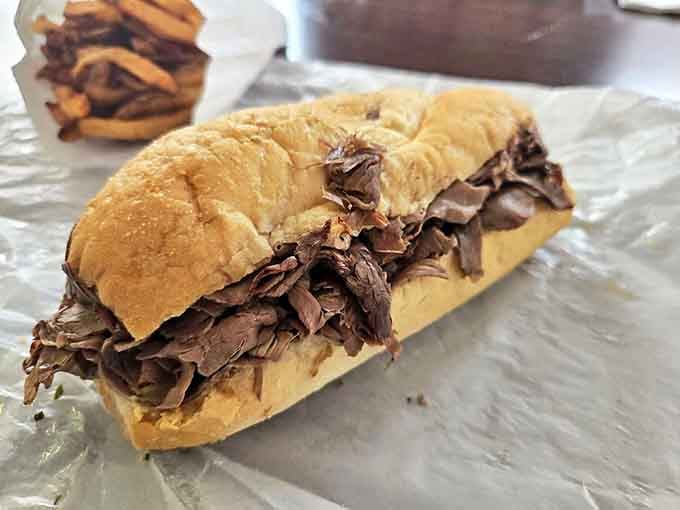 Behold the star of the show&mdash;paper-thin beef piled high on a roll, glistening with jus. Poetry doesn't get more beautiful than this.