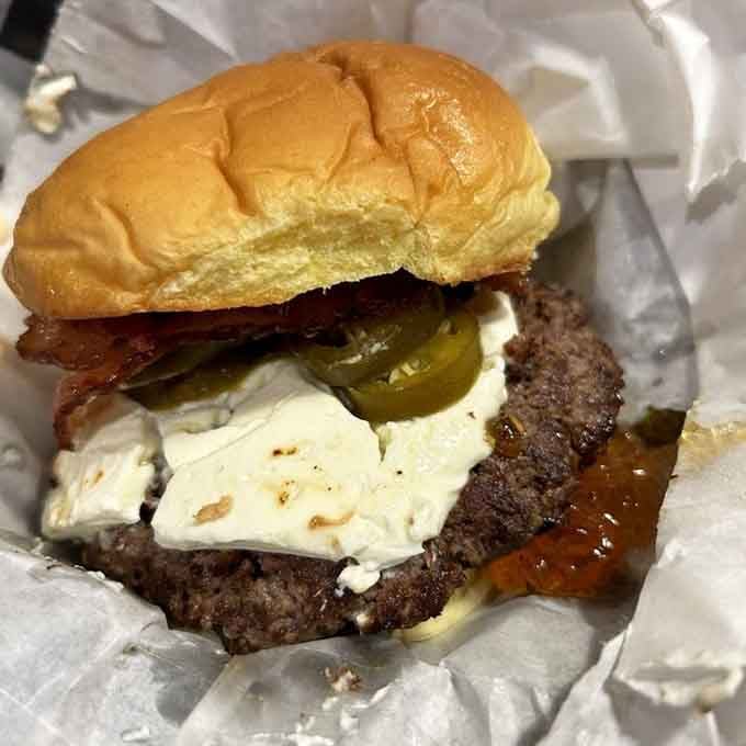 The Cobra Kai Burger arrives ready to strike your hunger with bacon, cheese, and pure satisfaction.