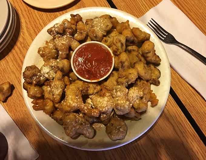 The gizzard sampler arrives like a golden treasure chest, proving the restaurant's namesake isn't just for show.