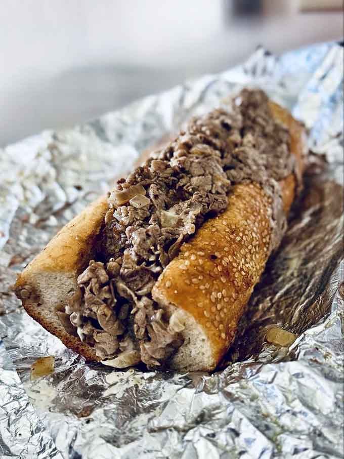 Behold the cheesesteak that makes tourists rethink their downtown lunch plans and locals smile knowingly.