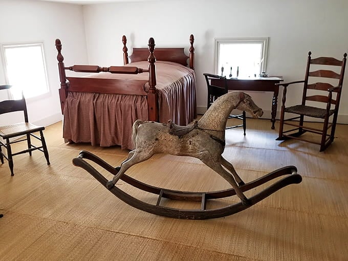 That weathered rocking horse has seen generations of children, standing guard like a wooden sentinel of simpler times.