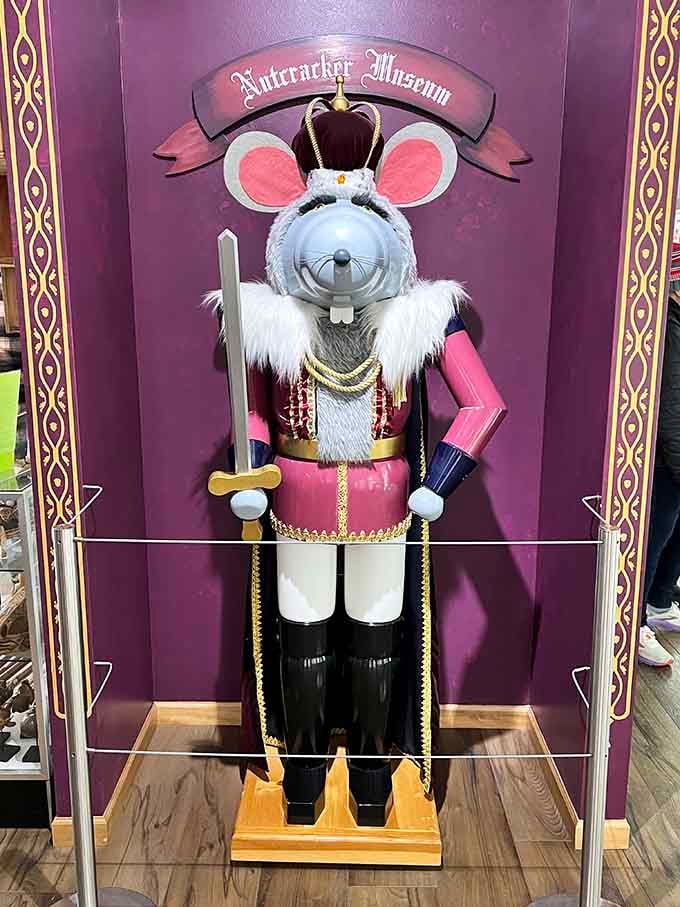 The Mouse King holds court in purple velvet splendor, proving villains always get the best decorating budgets.