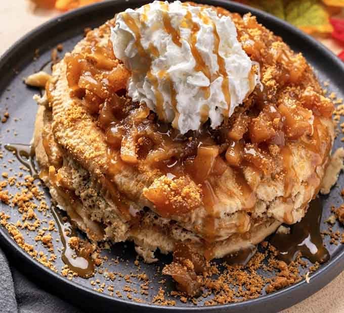 Behold the apple pie pancakes: fluffy towers of breakfast genius topped with cinnamon apples and whipped cream.