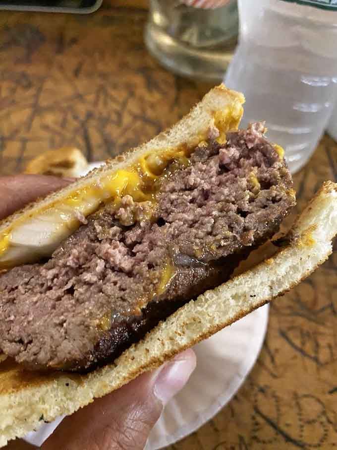 Behold the original hamburger, cooked medium rare on century-old vertical grills, served on toast like it's always been.