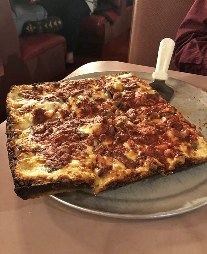 This deep-dish masterpiece arrives at your table looking like it could anchor a small boat, deliciously.