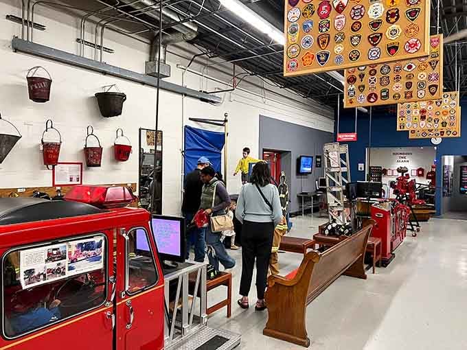 Visitors explore treasures of bravery while department patches create a kaleidoscope overhead celebrating firefighting communities everywhere.