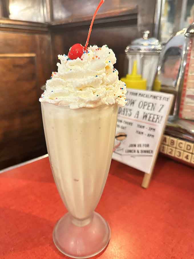 Topped with whipped cream and a cherry, this milkshake is basically happiness served in a glass with sprinkles.