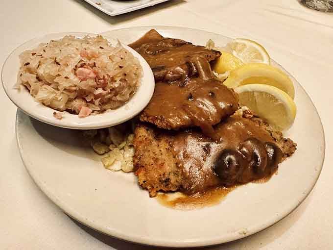 Golden-crusted Wiener Schnitzel arrives with spaetzle and red cabbage&mdash;comfort food that earned its legendary status decades ago.