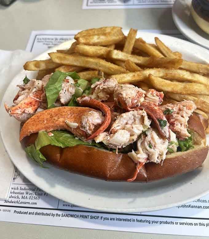 That lobster roll with a mountain of fries is basically summer vacation on a plate, minus the sunburn and traffic.