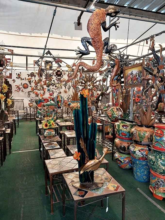 Metal art and garden decorations tower overhead, including that magnificent copper gecko who's clearly the star here.