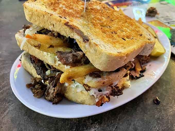 The Mad Hungarian: a towering masterpiece of meat, cheese, and carbs that defies both gravity and restraint.