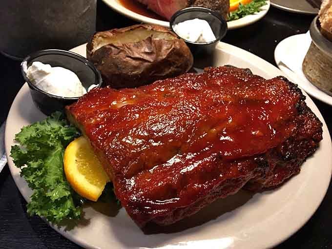 Baby back ribs so tender they're practically falling off the bone before you even pick up your fork, folks.