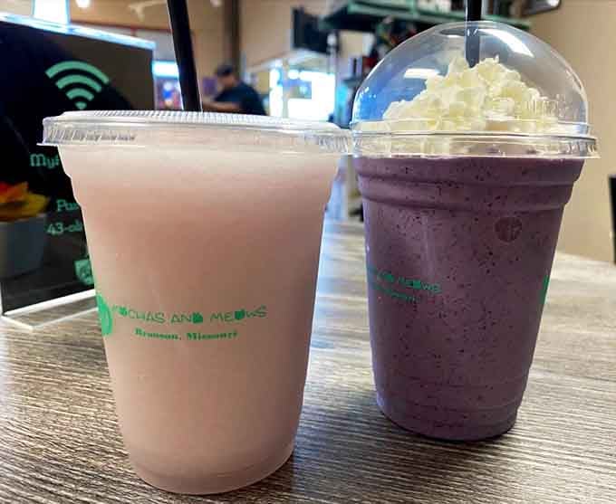 Two perfectly crafted beverages sitting side by side, waiting to fuel your cat-petting marathon like the dynamic duo they are.