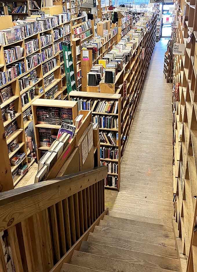 Narrow aisles packed with possibilities stretch toward infinity, making you feel like Indiana Jones hunting for literary treasure instead of artifacts.