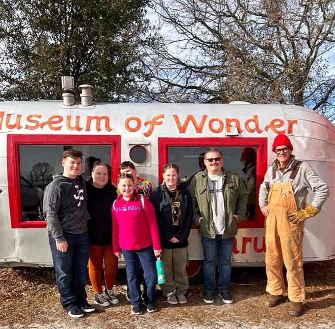 Nothing says "successful road trip" quite like posing with someone in overalls at a drive-thru museum in rural Alabama.