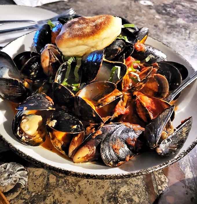 These mussels aren't just served, they're presented &ndash; a maritime masterpiece swimming in a broth so good you'll be plotting ways to drink it unnoticed.