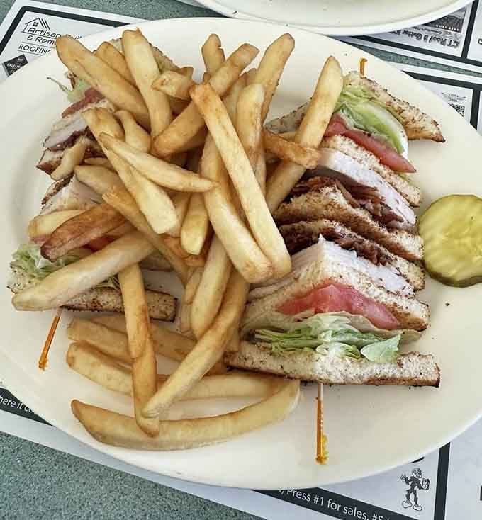 The turkey club stands tall and proud, a triple-decker monument to the art of not overthinking lunch.
