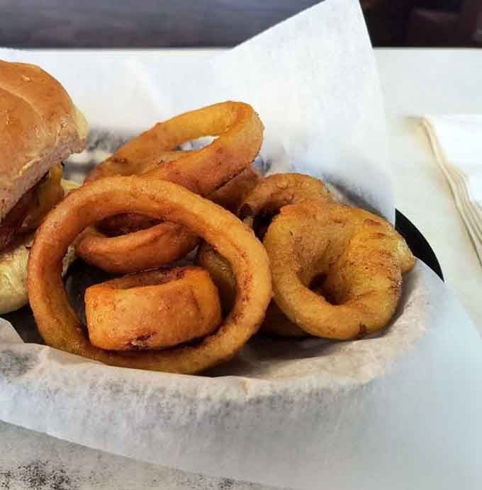 Golden halos of happiness – these aren't just onion rings, they're edible trophies that have earned their legendary status across Michigan.