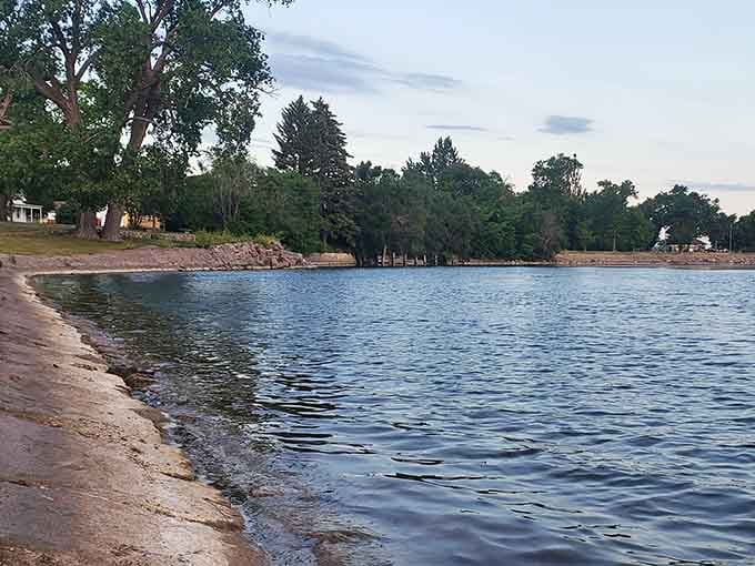 Sandy shores meet calm waters at this peaceful lakeside retreat perfect for sunset watching and quiet contemplation.
