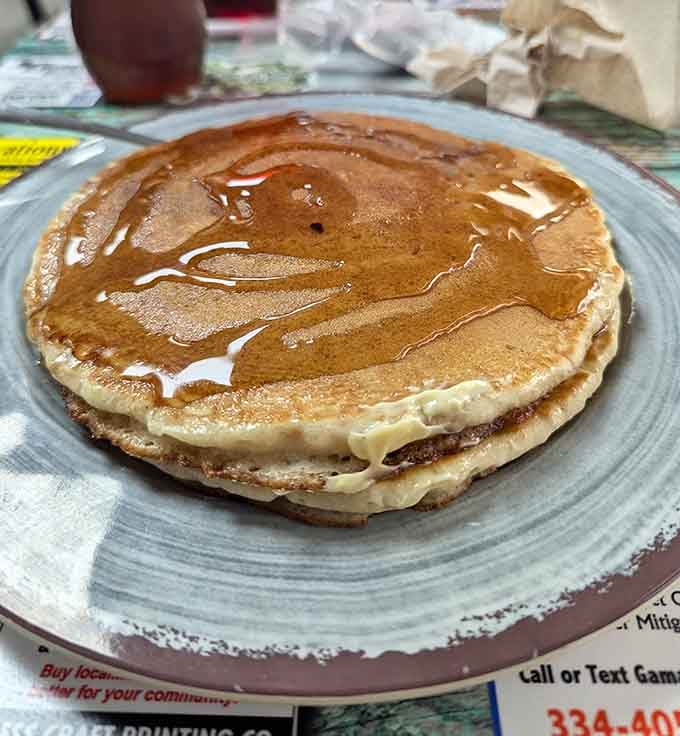 Golden, fluffy pancakes glistening with butter and syrup, proving that sometimes perfection really is this simple and delicious.