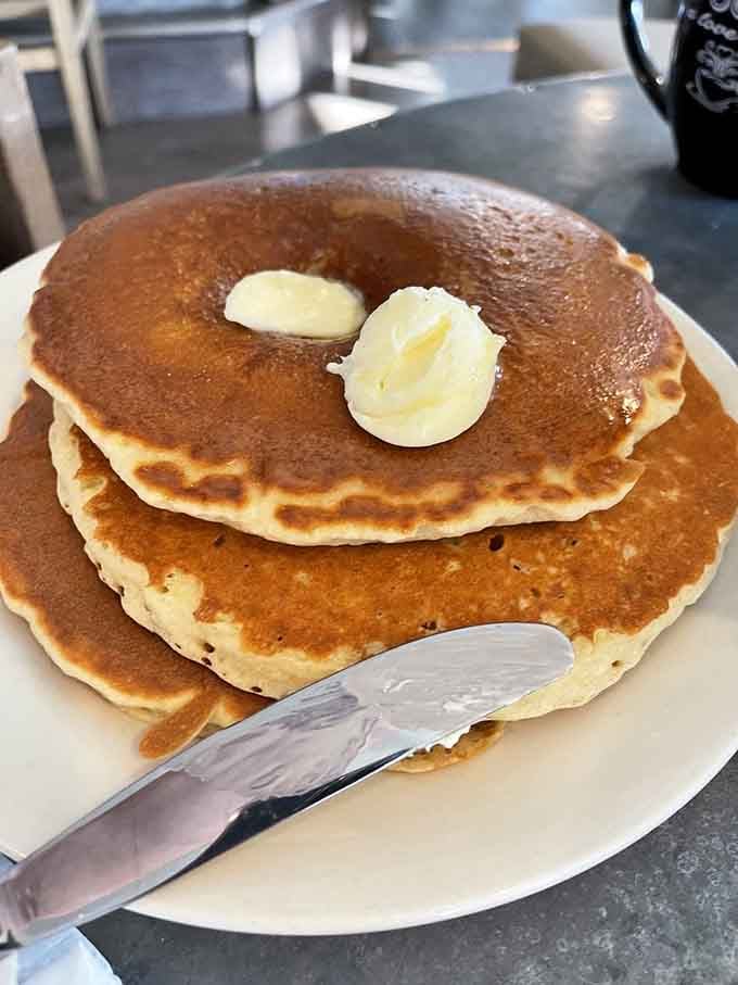 Behold the golden stack of dreams: fluffy buttermilk pancakes that justify setting your alarm on a Saturday morning.
