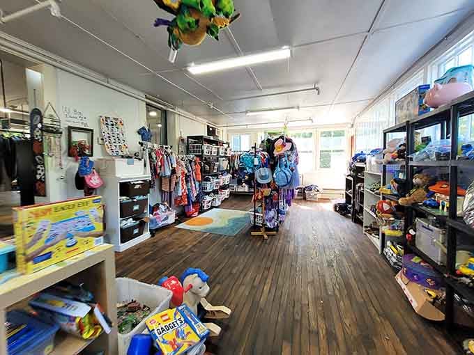 The kids' section where toys and clothes wait patiently for their next adventure, kites included for maximum childhood nostalgia.