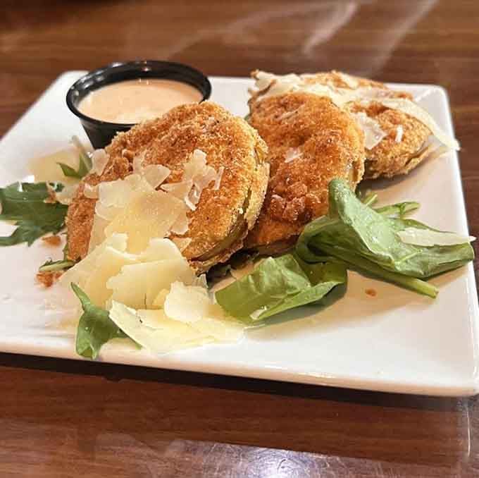Fried green tomatoes with parmesan shavings prove that Southern classics can get even better with creative touches.