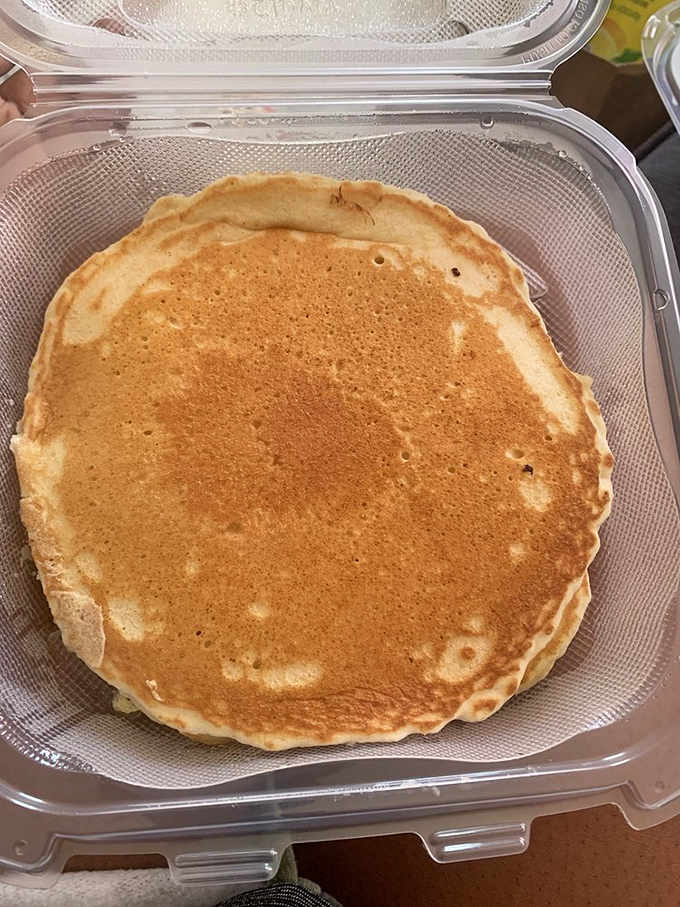 Behold the pancake that launched a thousand return visits, golden and perfectly round like breakfast should be.