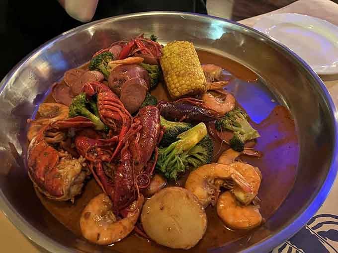 Crawfish, shrimp, corn, and potatoes swimming in spicy broth create the kind of feast that requires bibs and bravery.