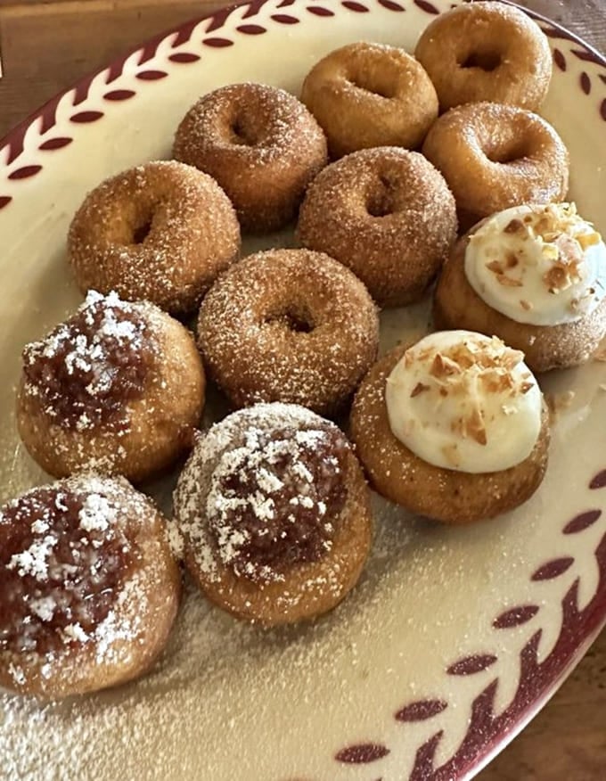 A plate of mini doughnuts in various flavors proves that variety isn't just the spice of life, it's dessert too.