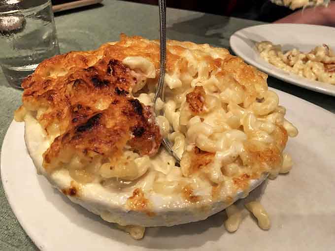 Behold the golden-crusted masterpiece that's been haunting dreams and ruining all other mac and cheese since its first appearance.