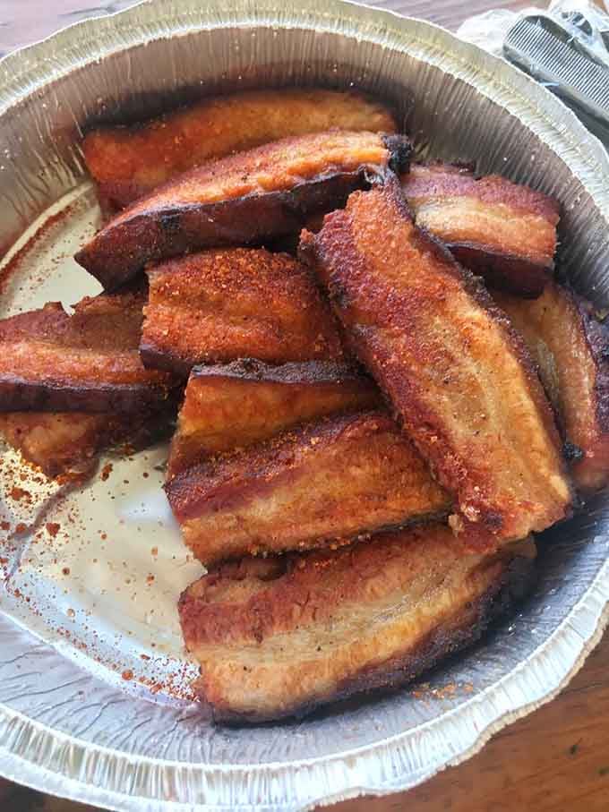 Pork belly nirvana! These glistening, caramelized chunks are what barbecue dreams are made of – crispy edges giving way to melt-in-your-mouth meat that's practically indecent.