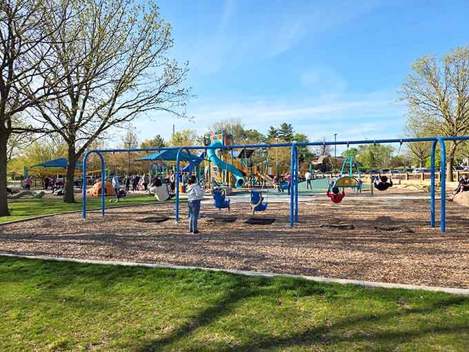 Blue structures reaching skyward like a playground architect's fever dream, where gravity becomes more of a suggestion than a rule.