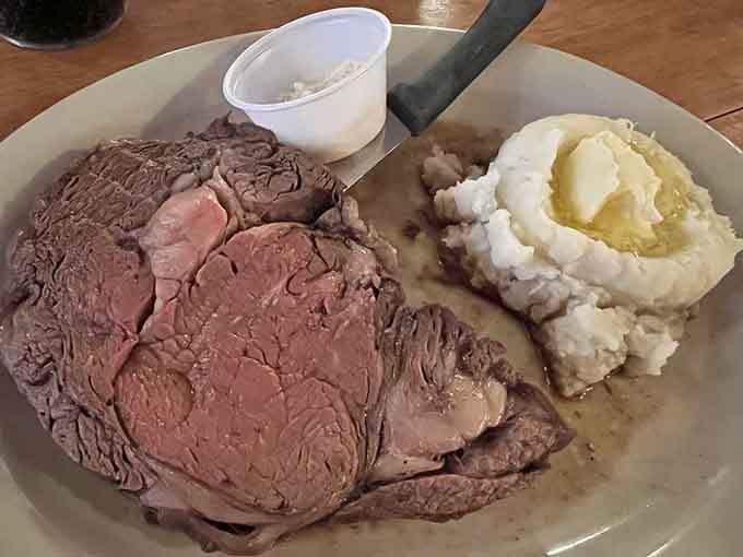This prime rib doesn't just arrive at your table&mdash;it makes an entrance, tender and pink, with mashed potatoes standing by for gravy duty.