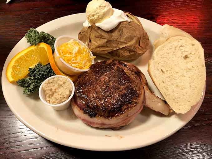That sear on the filet mignon is textbook perfection, with a baked potato so fluffy it deserves its own standing ovation.