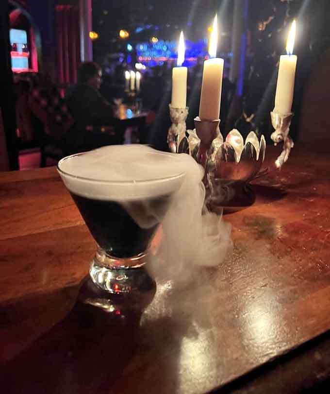 This cocktail arrives with more drama than a soap opera finale, complete with fog effects.