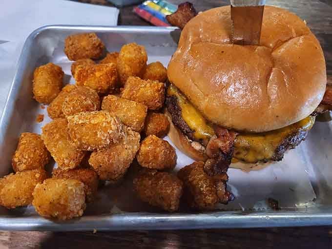 Golden tots and a juicy burger on a metal tray is the fuel champions need between rounds.